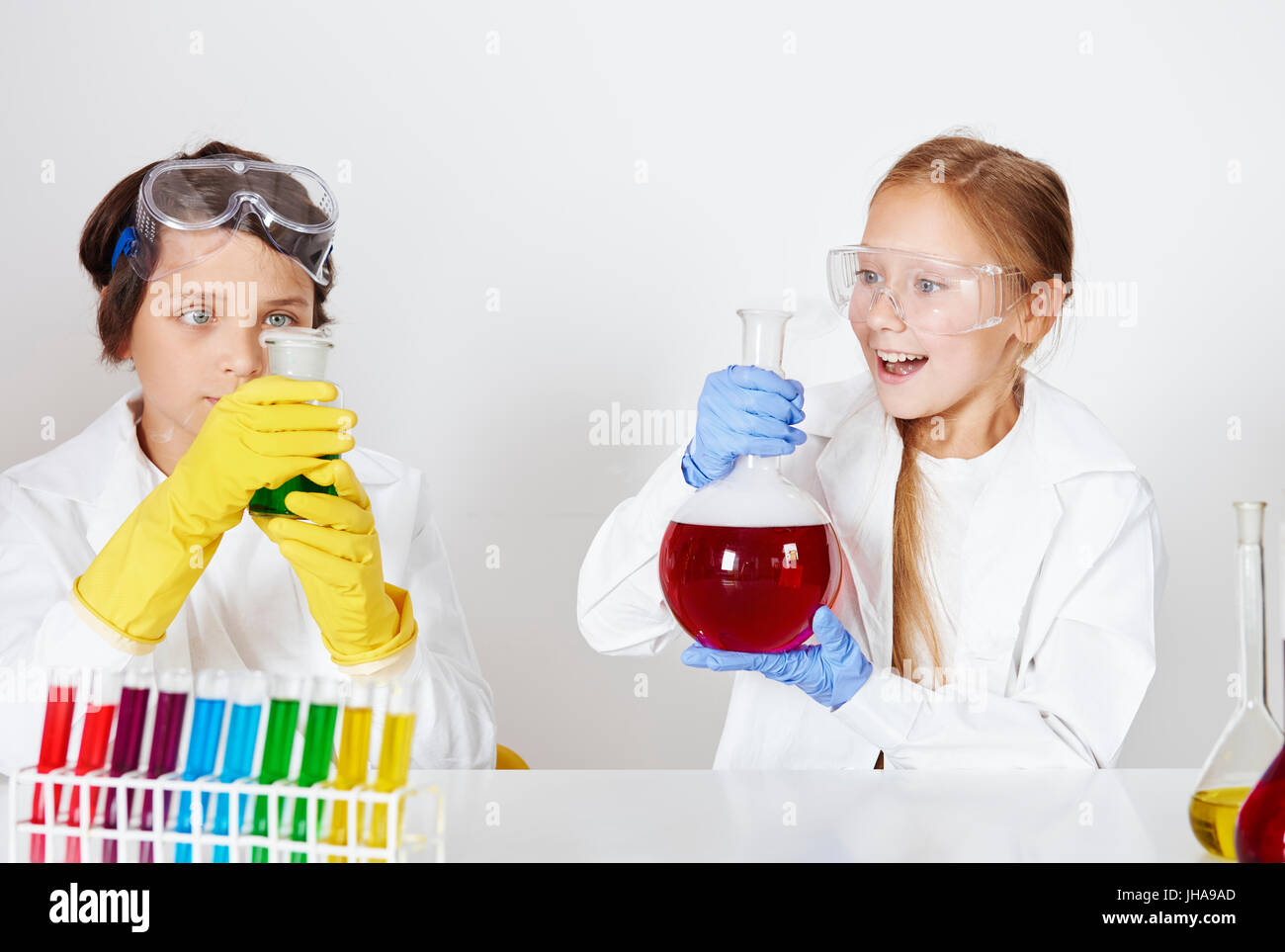 Happy kids making a experiment Stock Photo - Alamy
