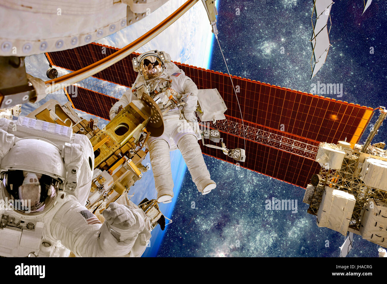 International Space Station and astronaut in outer space over the planet Earth. Elements of this ...