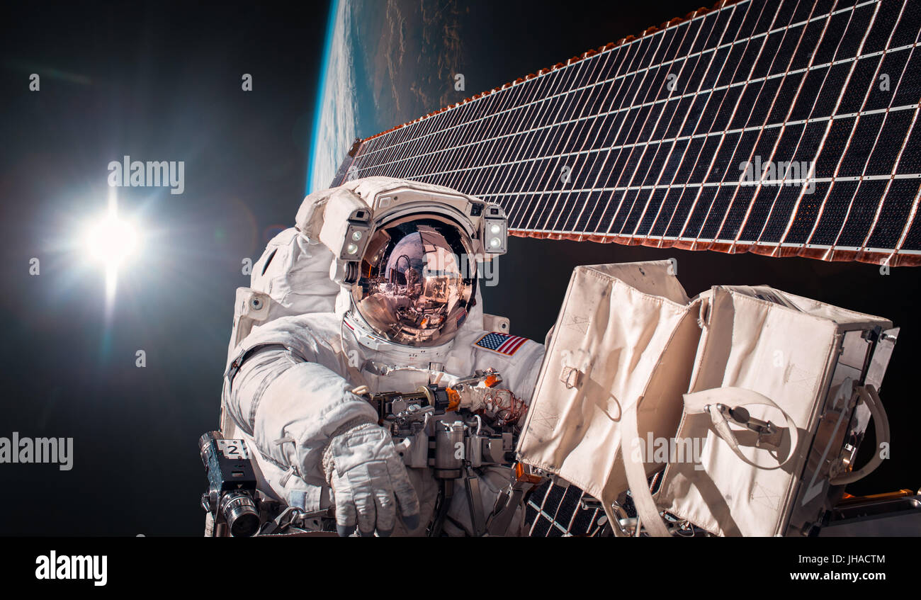 International Space Station and astronaut in outer space over the ...