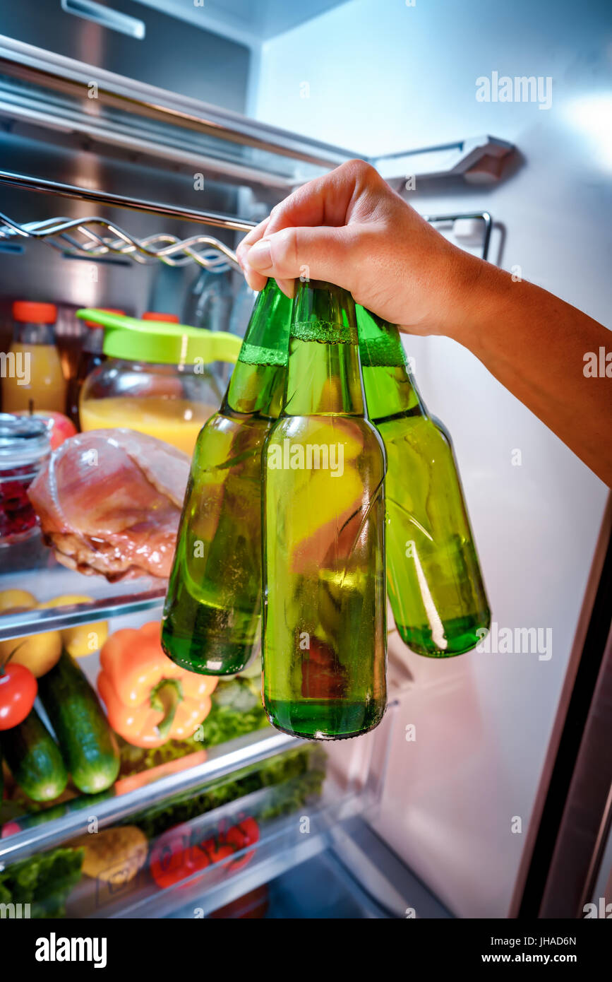 Man taking beer from a fridge Stock Photo - Alamy