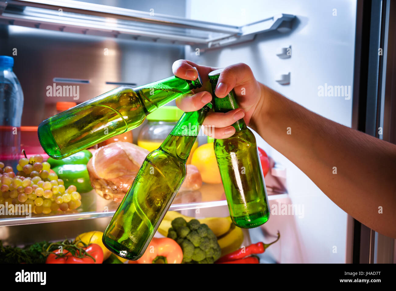 Man taking beer from a fridge Stock Photo - Alamy