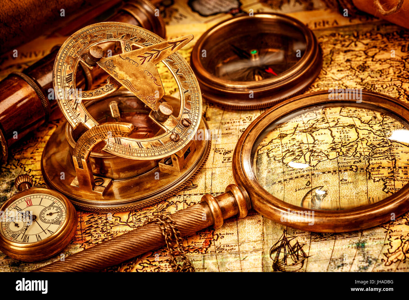 Vintage still life. Vintage magnifying glass lies on an ancient world ...