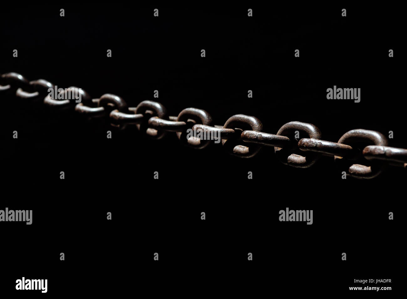 Steel chain spotlighted punctual diary lights on black background Stock ...