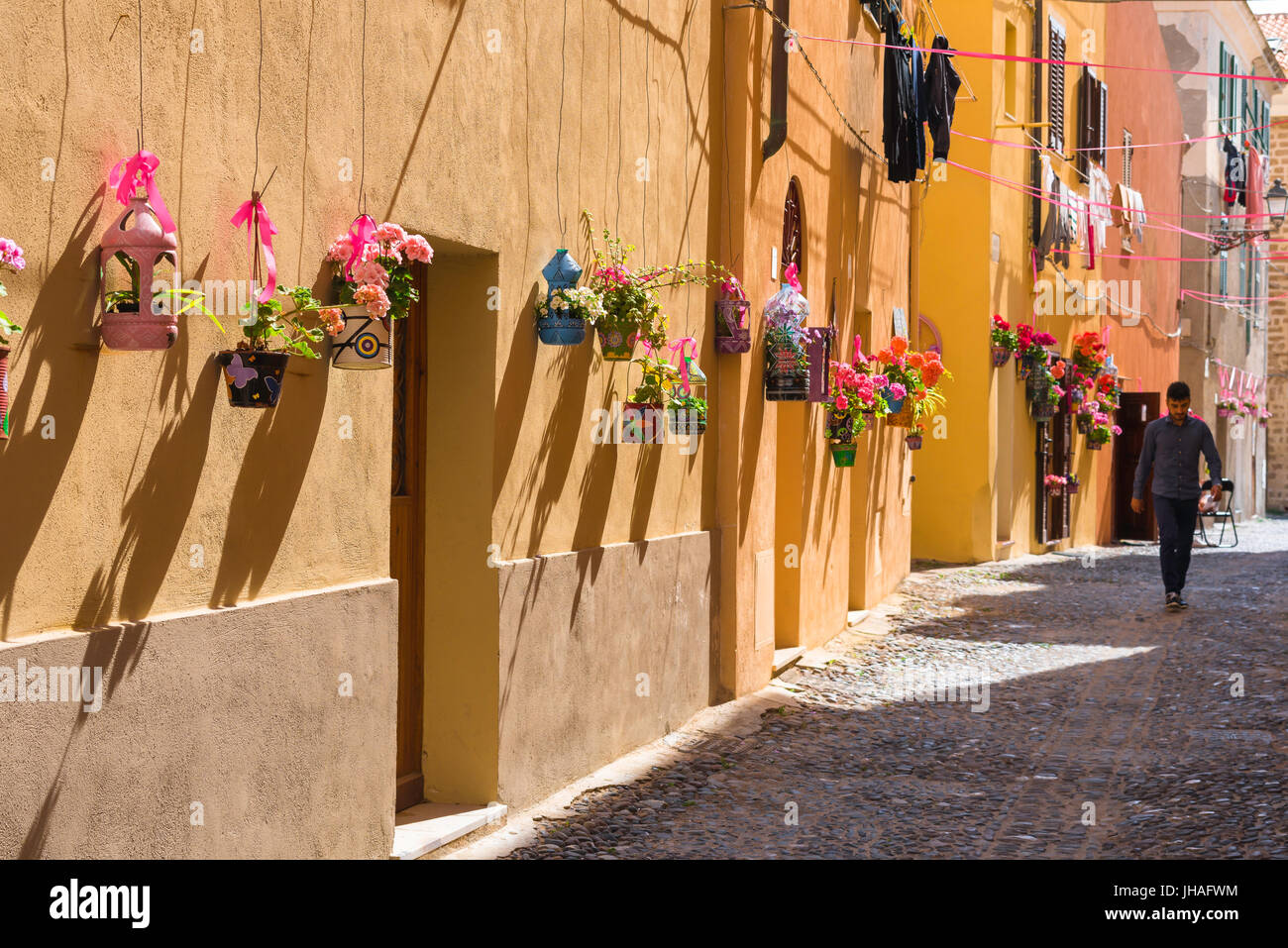 Sardinia Alghero, view of a colourful street in the old town quarter of ...