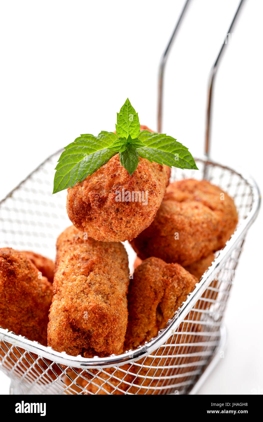 closeup of some homemade croquetas, spanish croquettes, served in a ...