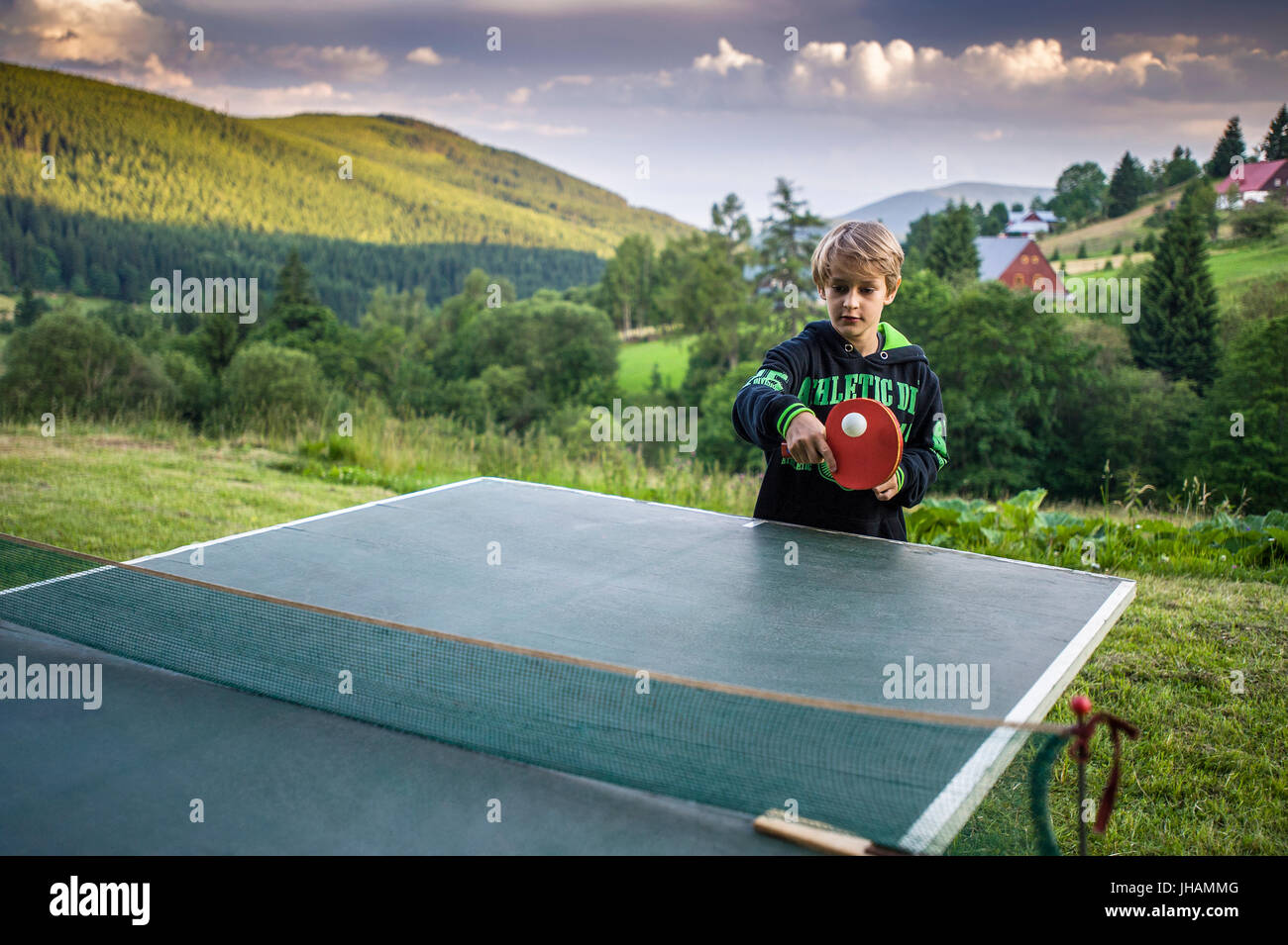 school boy playing ping-pong outdoor Stock Photo - Alamy