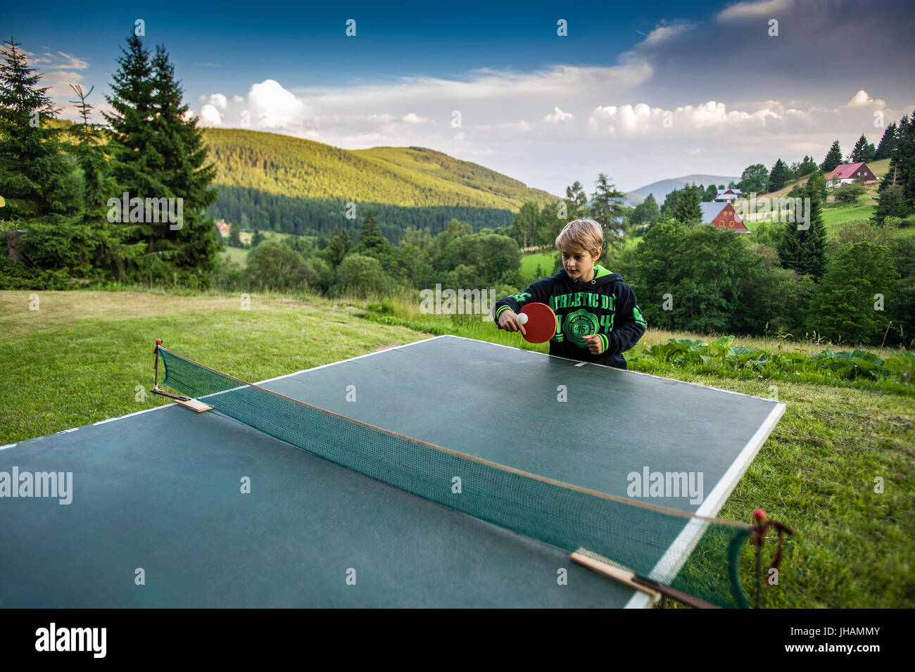 school boy playing ping-pong outdoor Stock Photo - Alamy