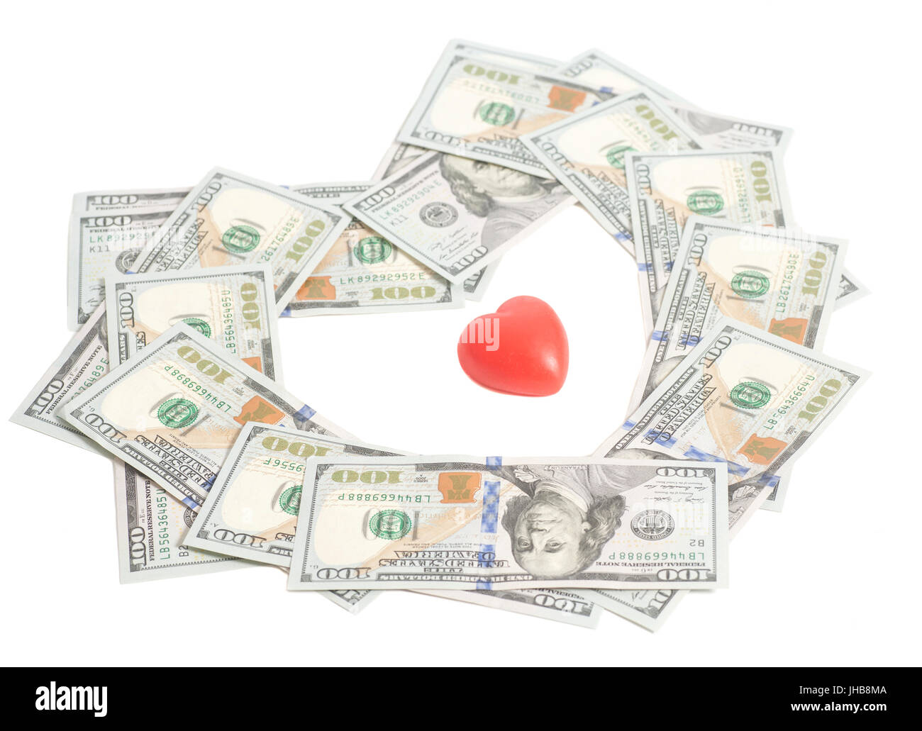 Heart shape made of dollars bills isolated on white Stock Photo - Alamy
