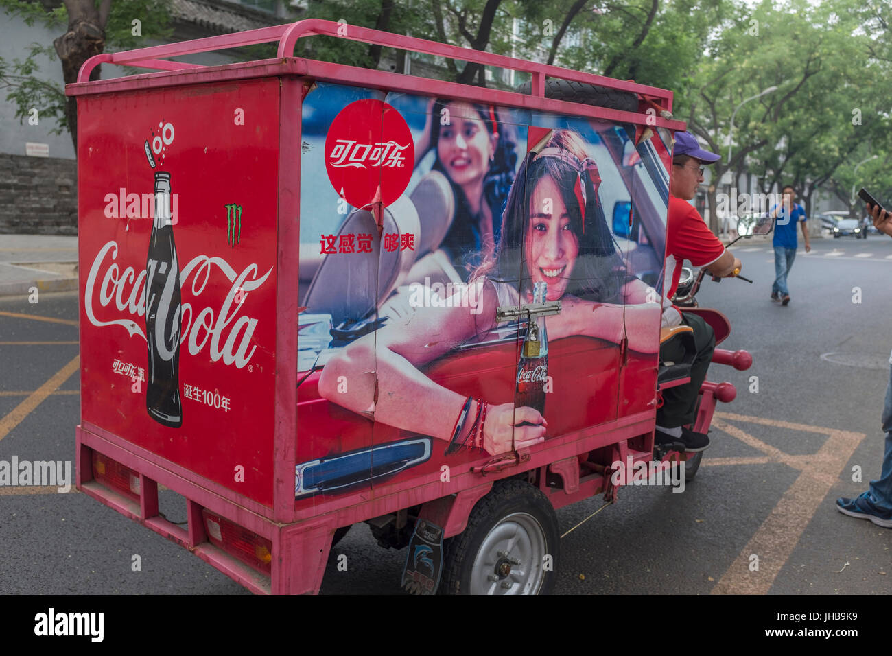 An electric tricycle features Coca-Cola celebrating the 100th birthday ...