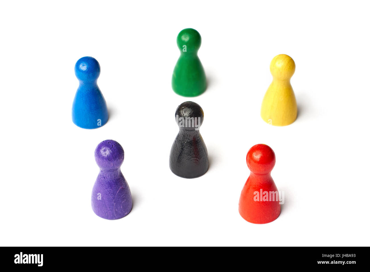 Six game figures standing in a circle with a black figure in the middle ...
