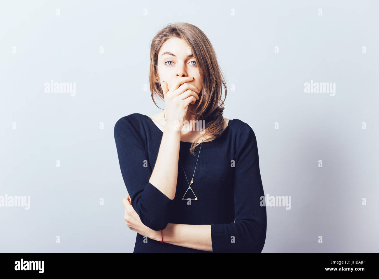 Young Woman Holding Mouth Shut High Resolution Stock Photography and ...