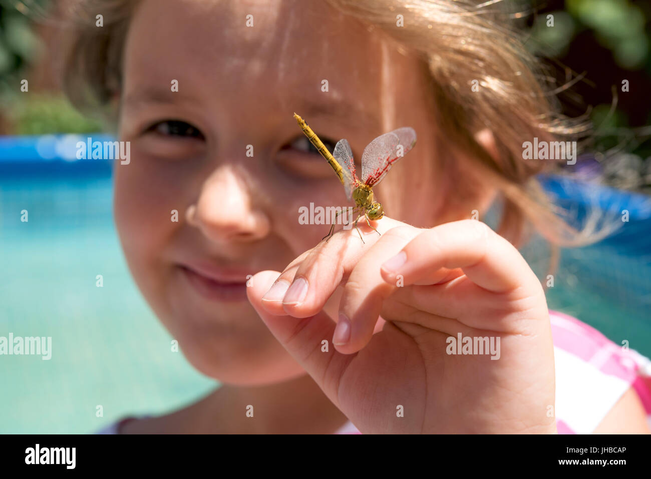 baby with dragonfly Stock Photo - Alamy