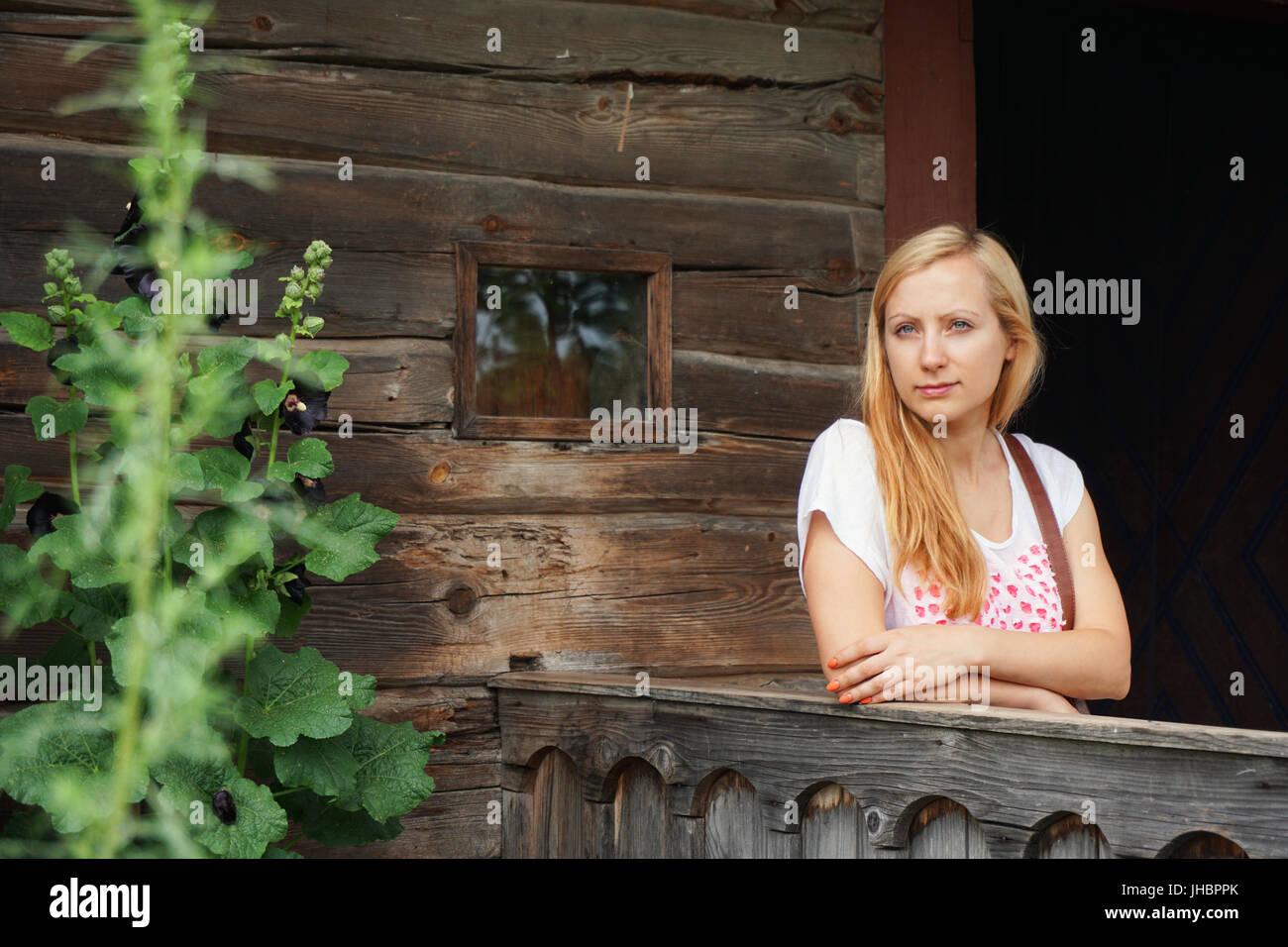 beautiful woman at porch wooden house Stock Photo - Alamy