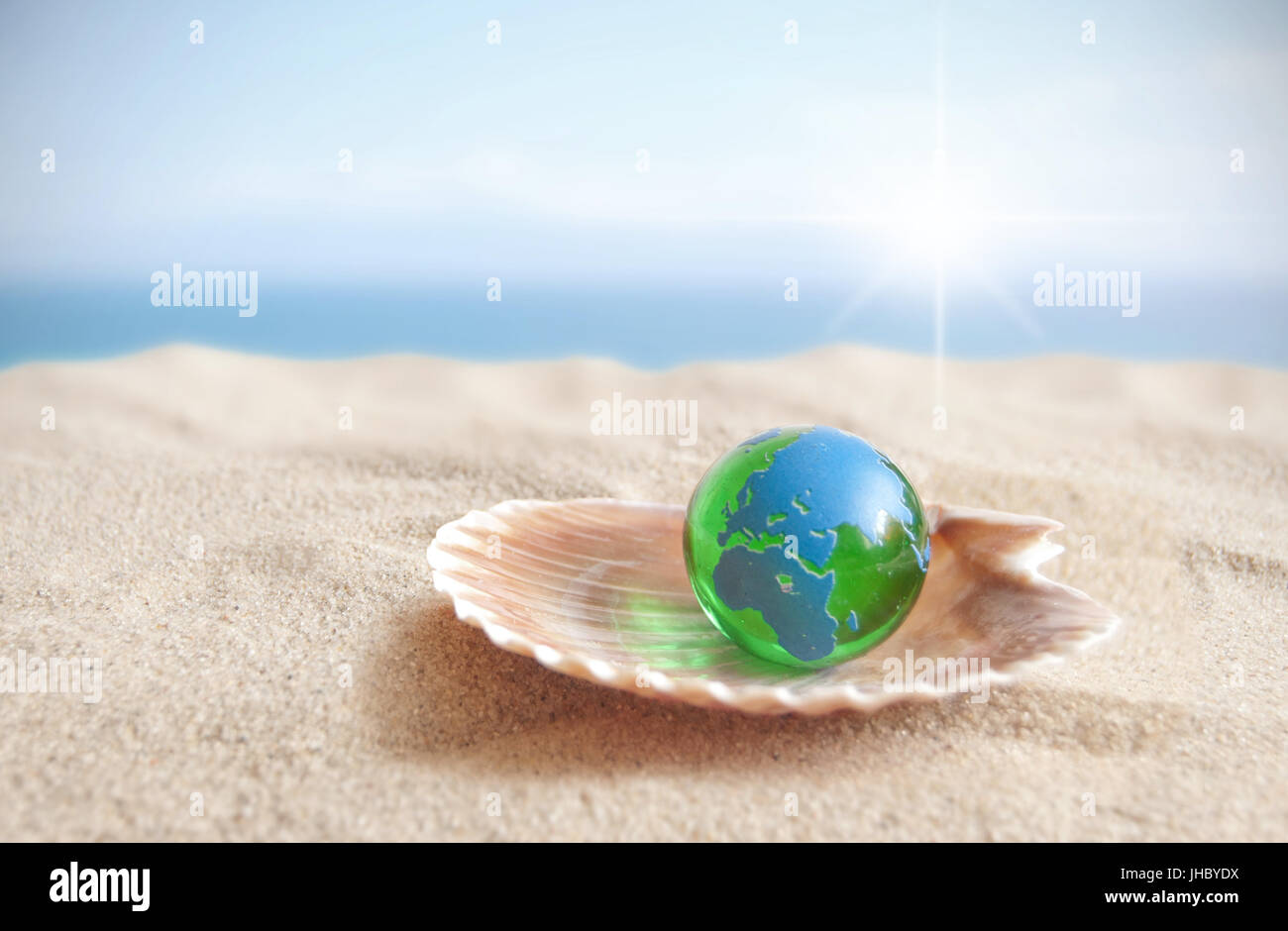 World globe inside an open shell Stock Photo - Alamy
