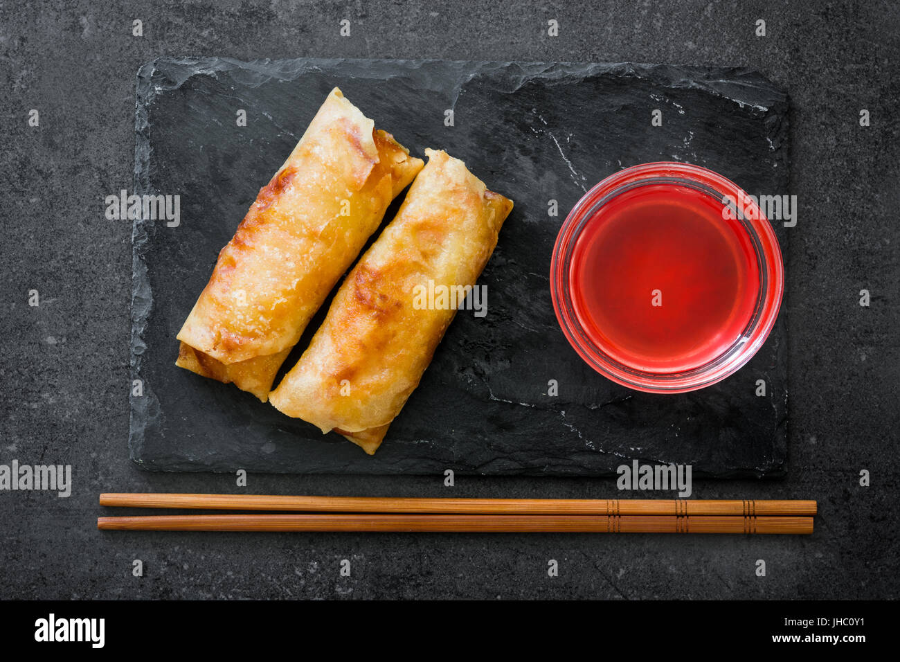 Vegetable spring rolls on black slate Stock Photo - Alamy