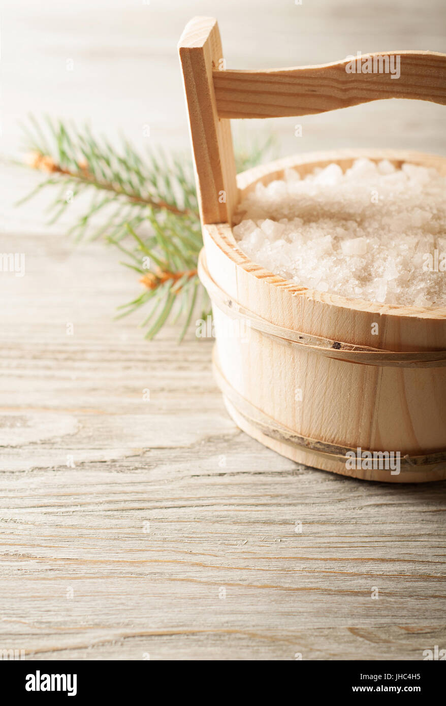 Aromatic bath salt in wooden bucket and pine branch Stock Photo - Alamy