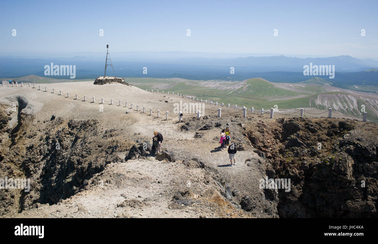 Western tourists on summit of Mount Paektu on edge of volcanic crater ...