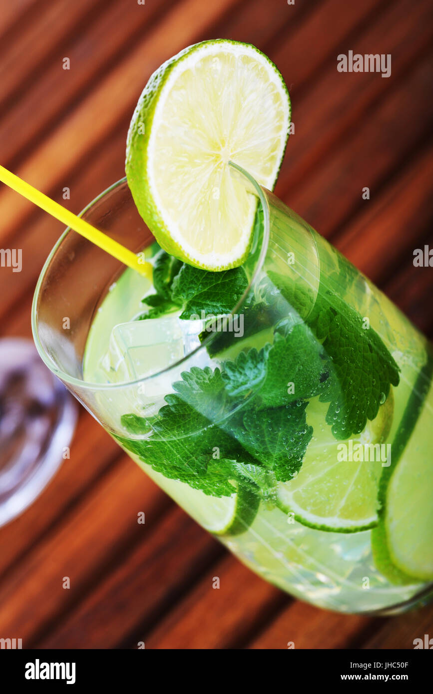 cocktail into glass and cubes of ice Stock Photo - Alamy