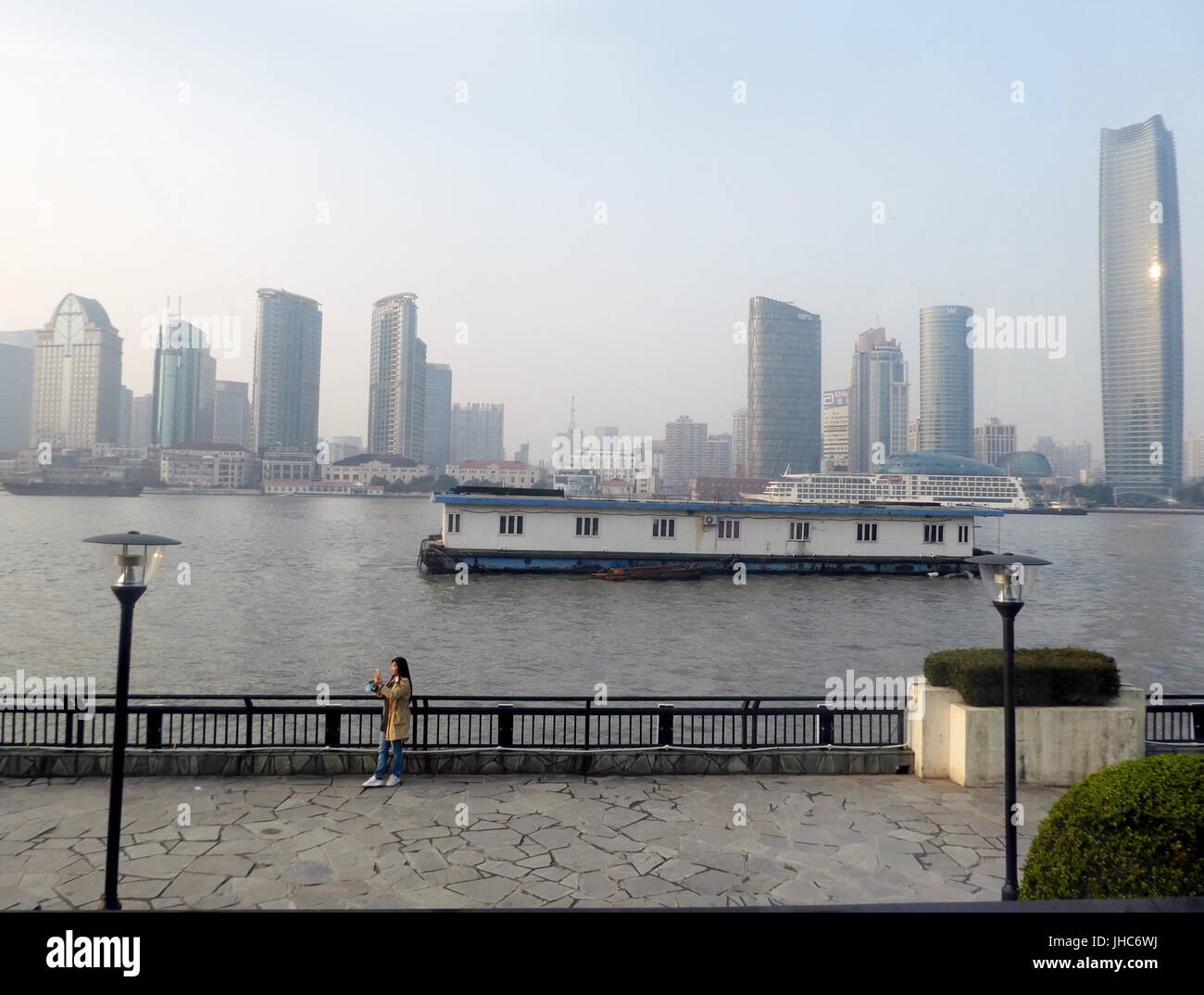 Woman taken photo in The bund waterfront hangpu river Shanghai China ...