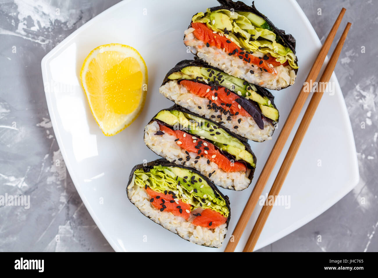Healthy Japanese onigirazu with fish, brown rice and vegetables Stock ...