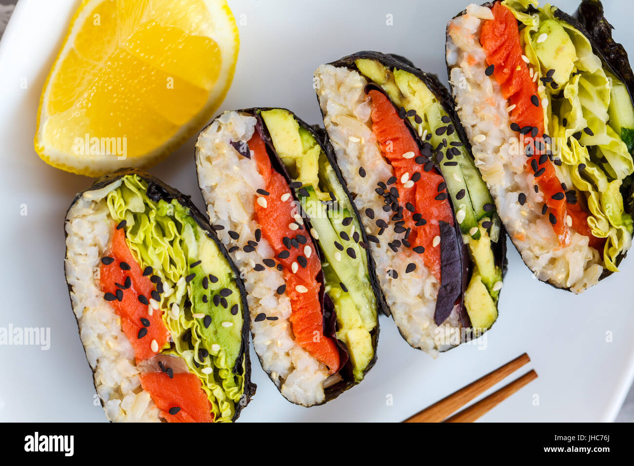 Healthy Japanese onigirazu with fish, brown rice and vegetables Stock ...