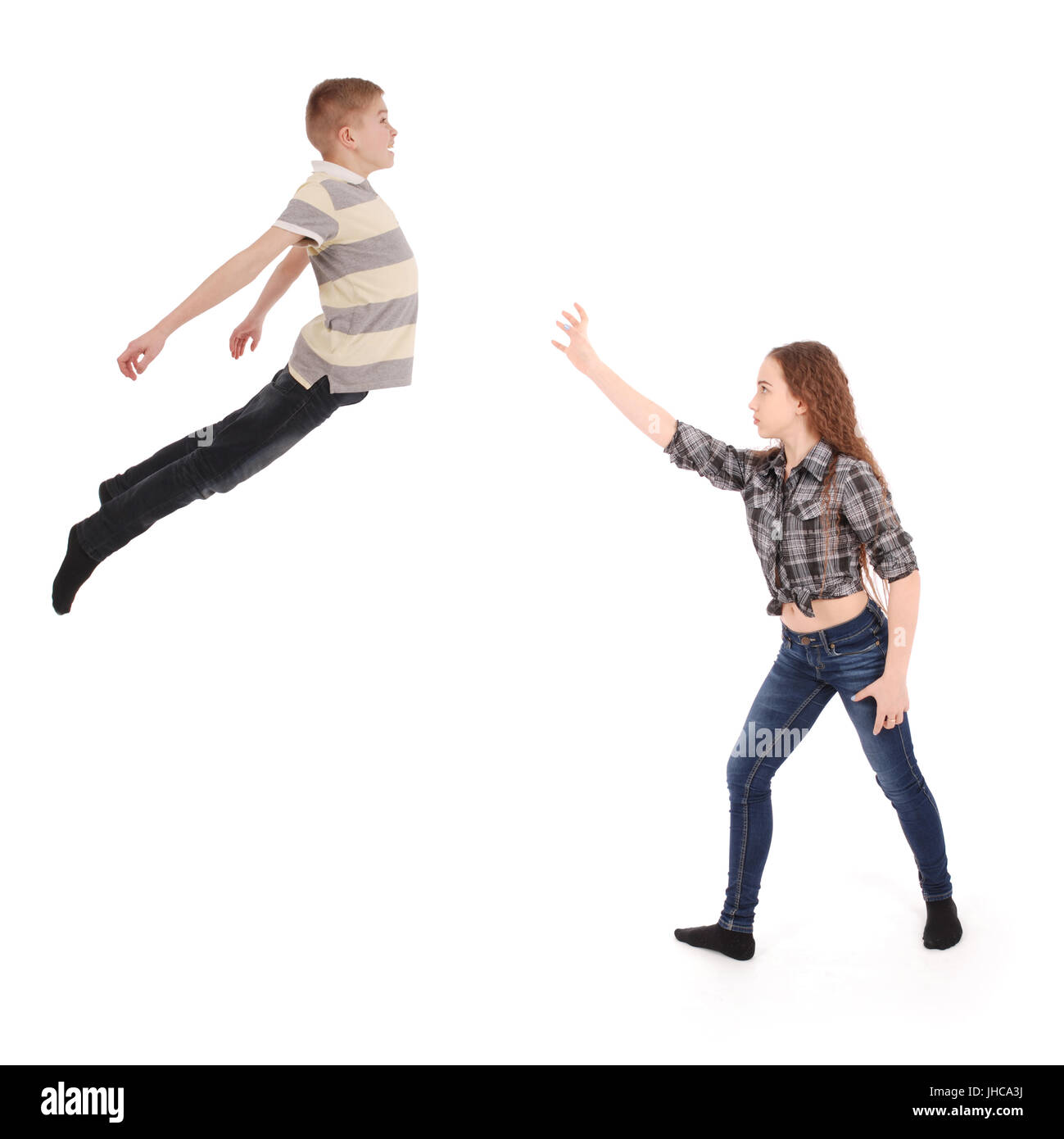 Girl keeps the boy in will in the air. Levitation with the power of ...