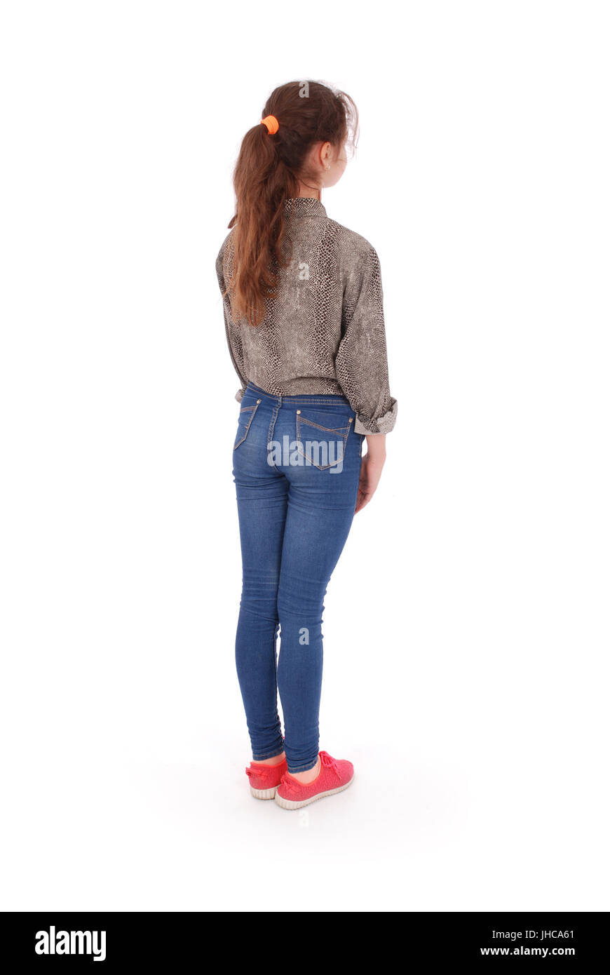 Portrait of a charming smiling girl, turned her back, isolated on a ...