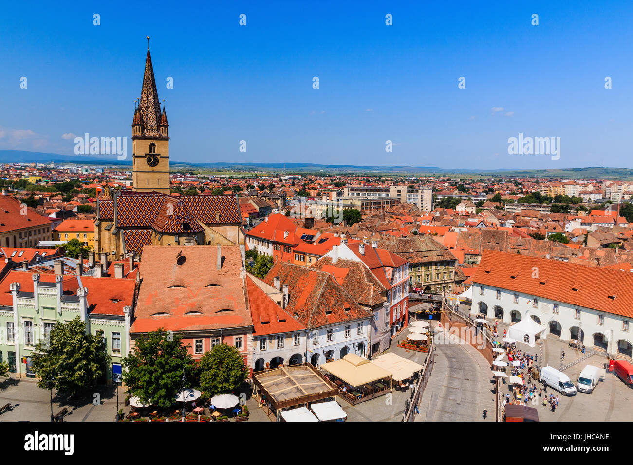 Sibiu,Romania.Old roofs of Lutheran cathedral tower and Small Square ...