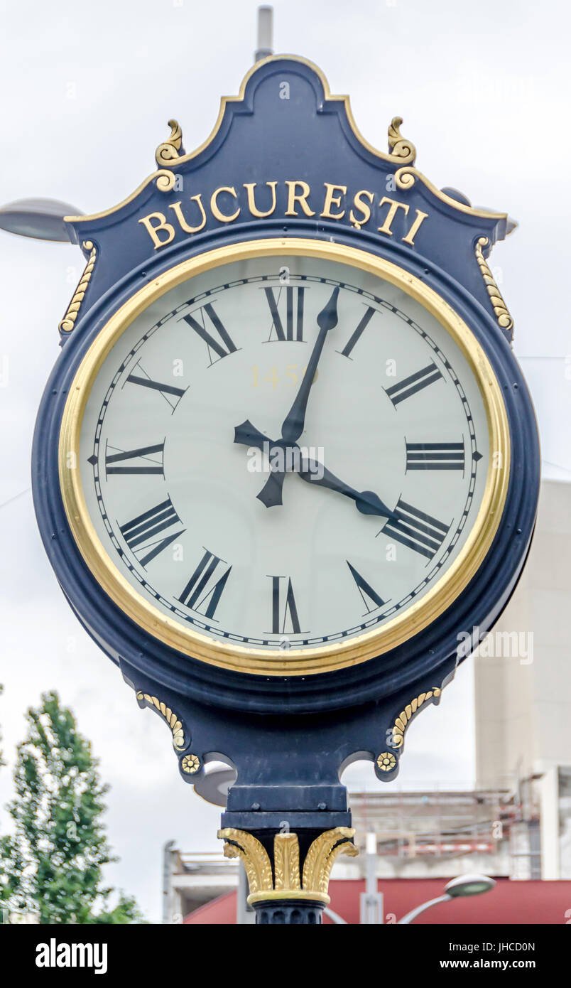 BUCHAREST, ROMANIA - MAY 25, 2014: Outdoor city clock near University ...