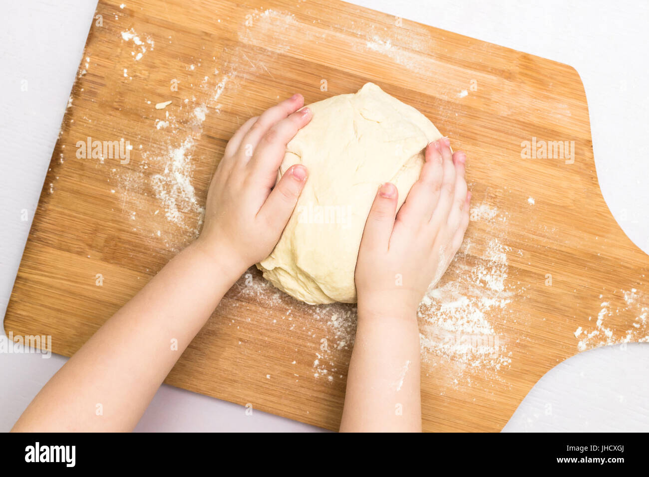 Children hands make a dough Stock Photo - Alamy