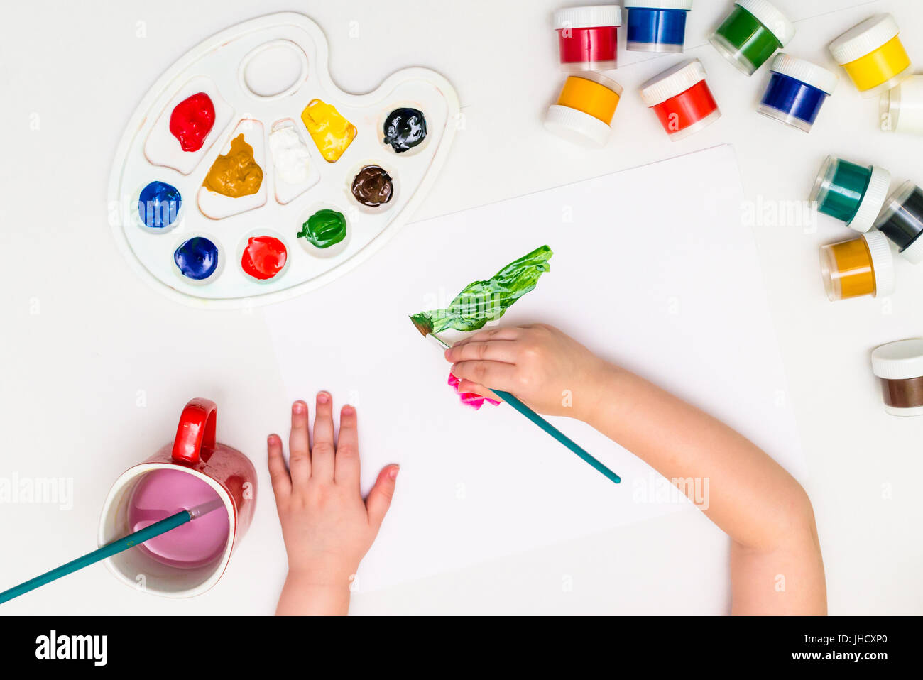 Child painting a flower Stock Photo - Alamy