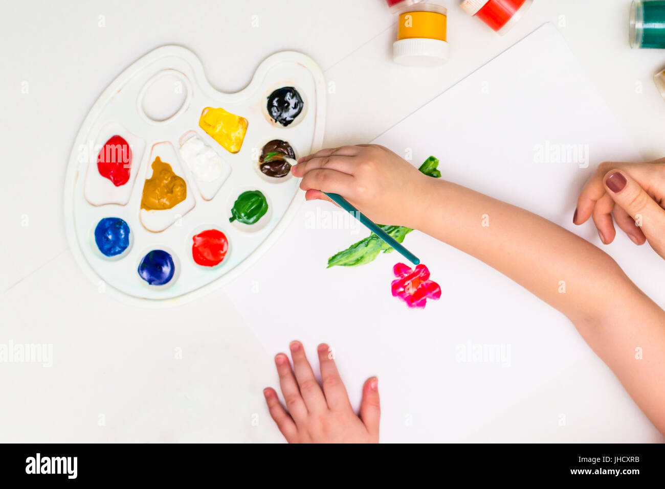 Child painting a flower Stock Photo - Alamy