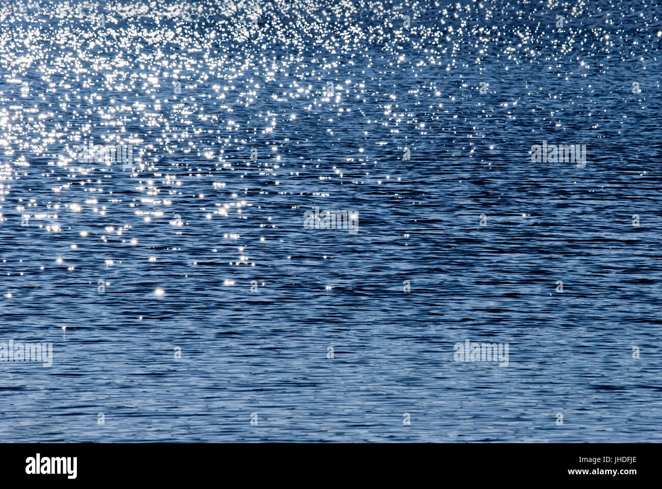 Water texture. Deep blue, gently rippled sea water filling frame with ...