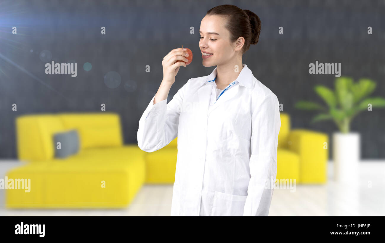 Beautiful medical woman doctor in uniform. Studio painted background ...