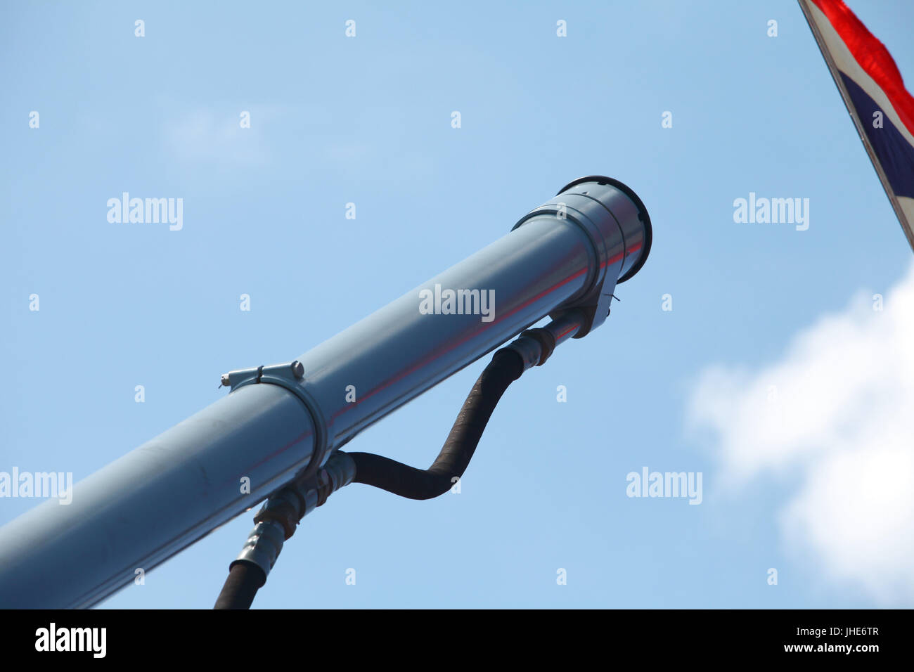 gun barrel and the flag against the blue sky Stock Photo - Alamy