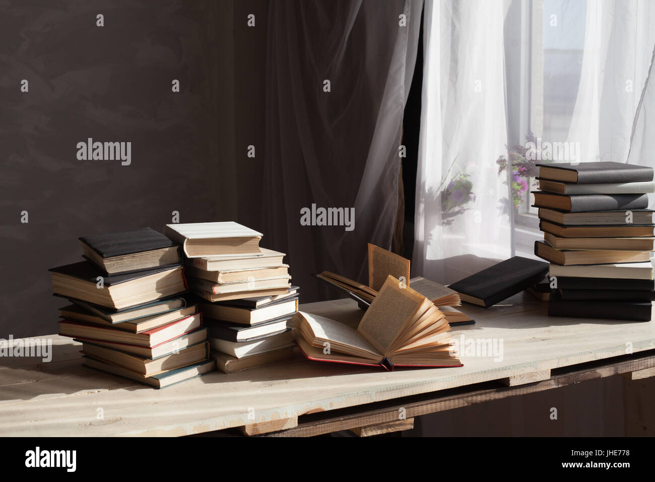 many books are on the table at home in the library Stock Photo - Alamy