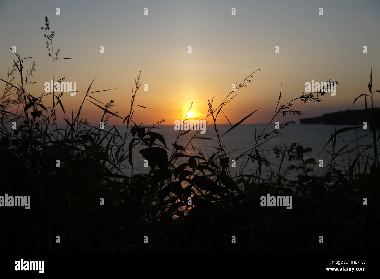 sunset in pantai kesirat Stock Photo - Alamy