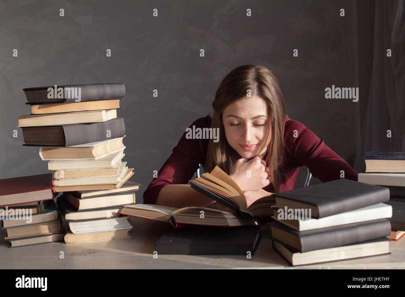 girl reading book prepares for the exam in the library Stock Photo - Alamy