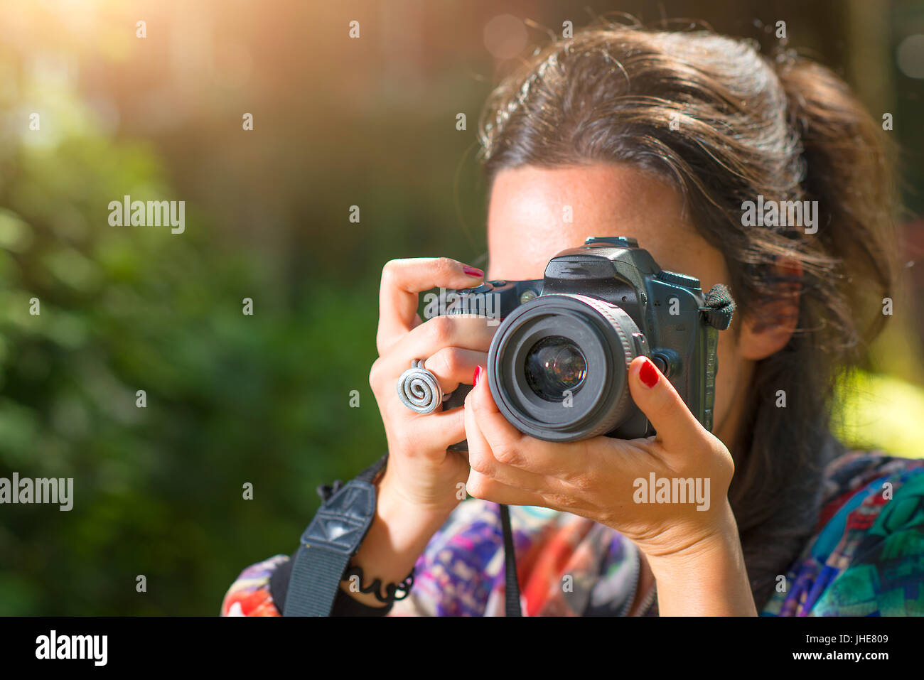 Girl photographer lens system to photograph Stock Photo - Alamy