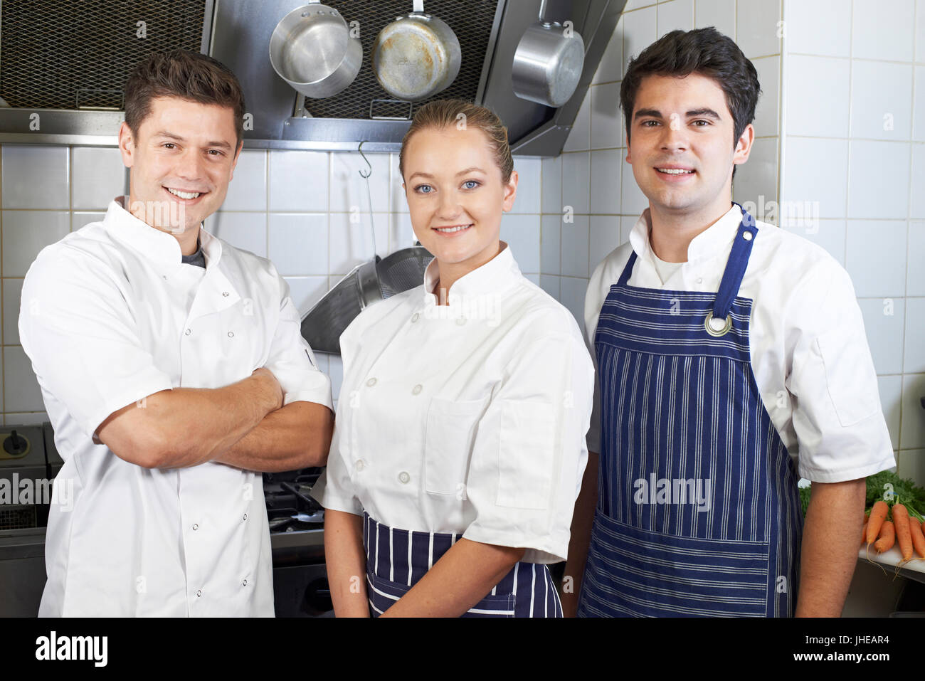 Man in kitchen looking saucepan hi-res stock photography and images - Alamy