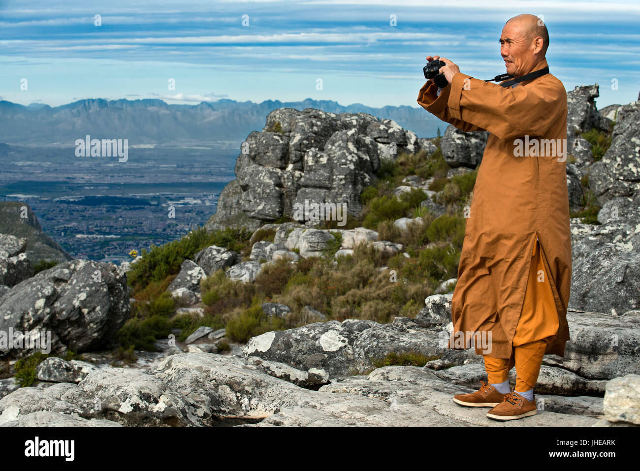 Asian monk in Table Mountain, taken pictures of Cape Town, Western Cape ...