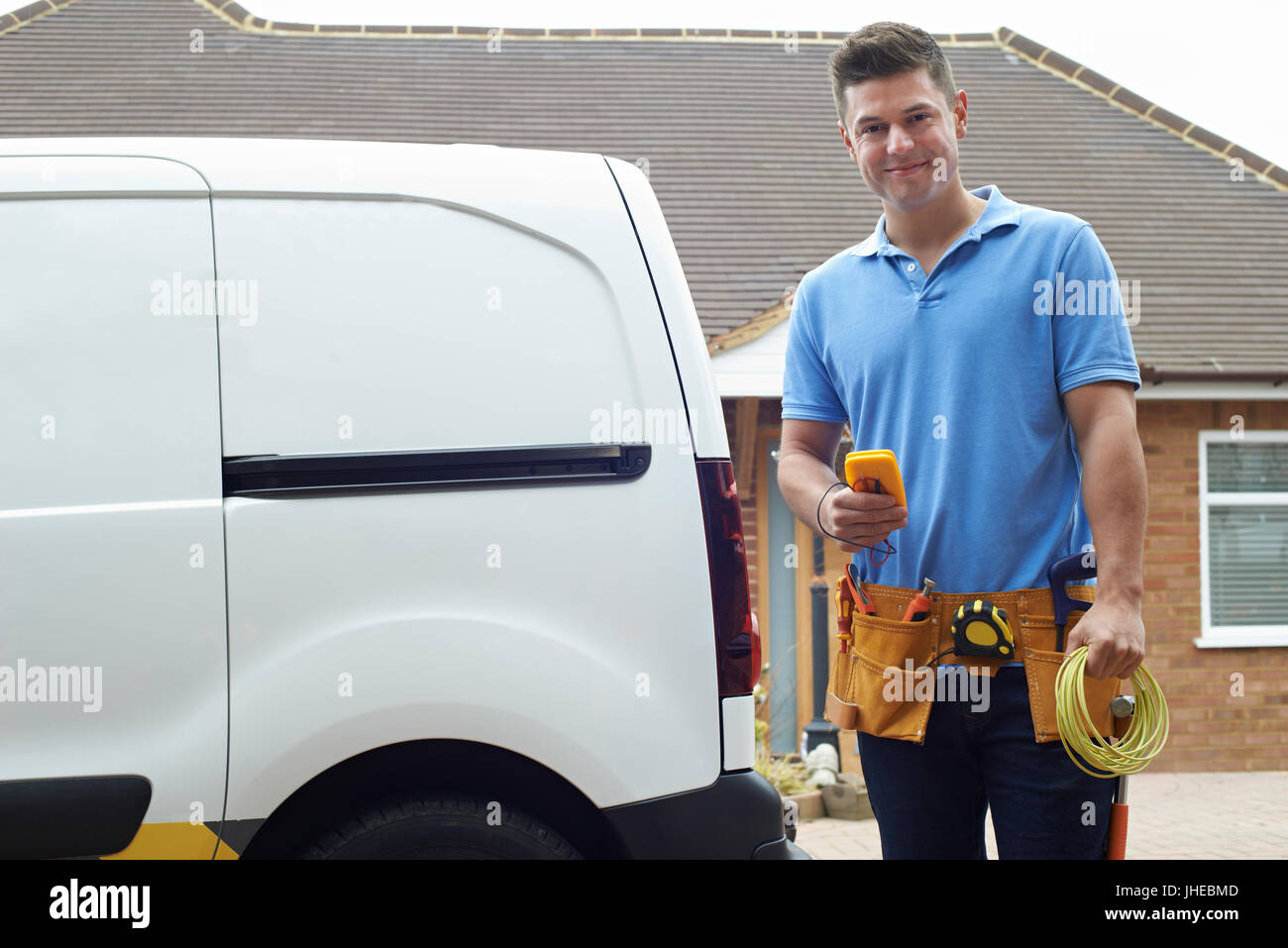 Portrait Of Electrician With Van Outside House Stock Photo - Alamy