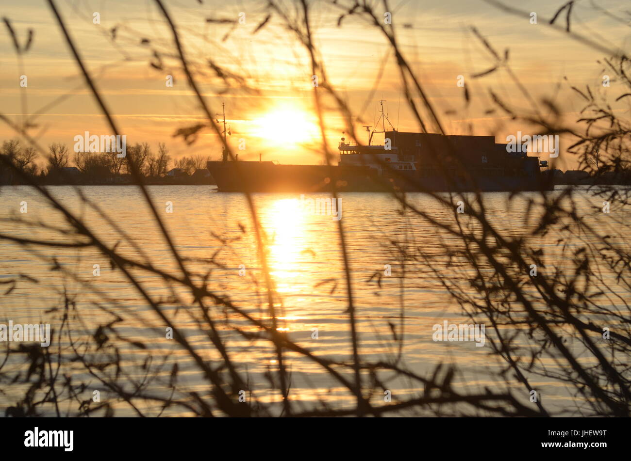 Ship at sunset Stock Photo - Alamy