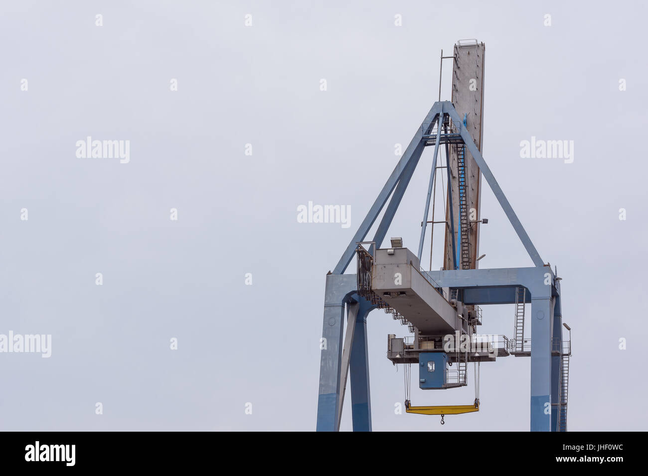Container crane against blue sky at the port of Hundested, Denmark ...