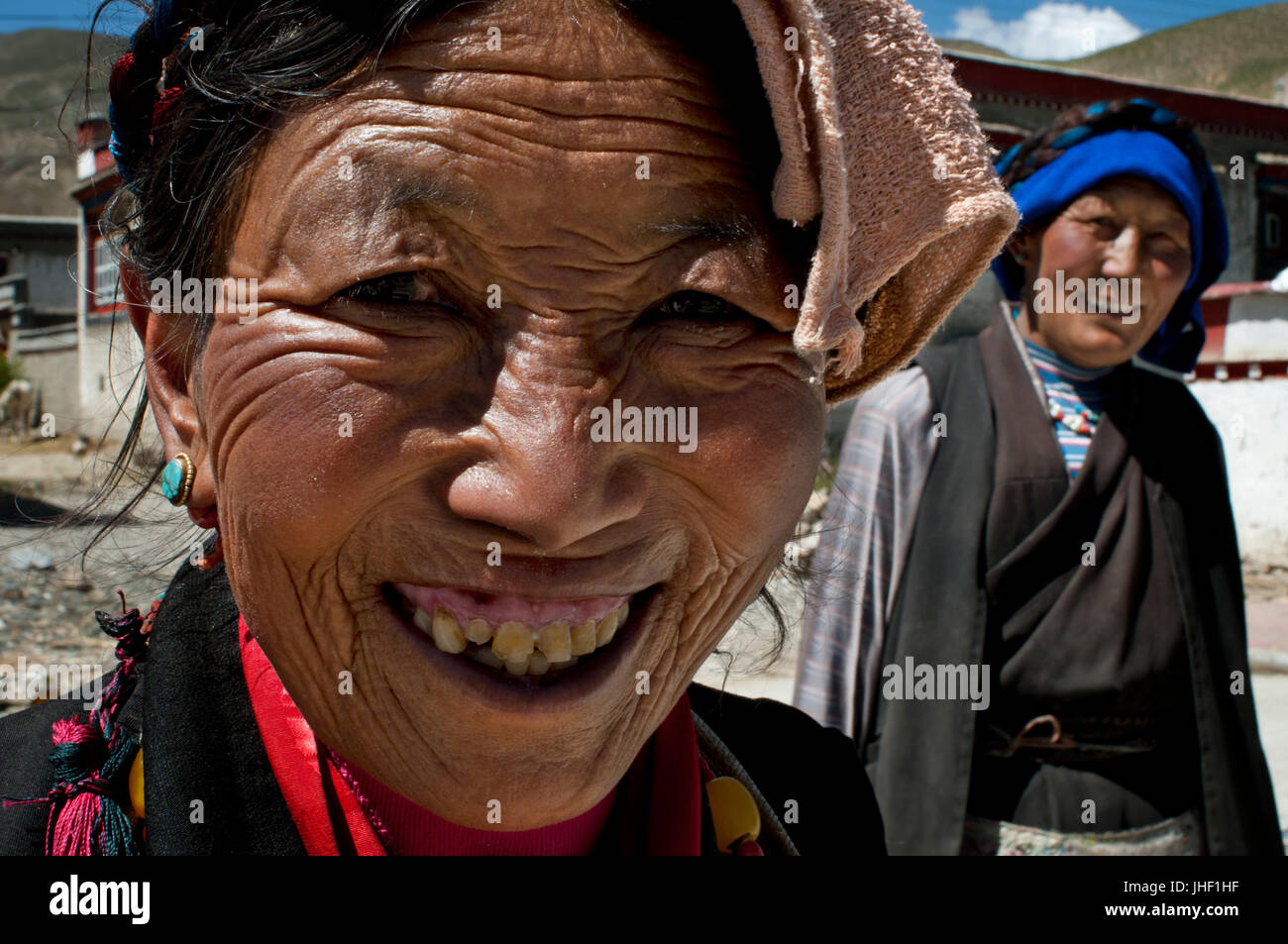 Women in the village of Bainans, located along the road separating ...