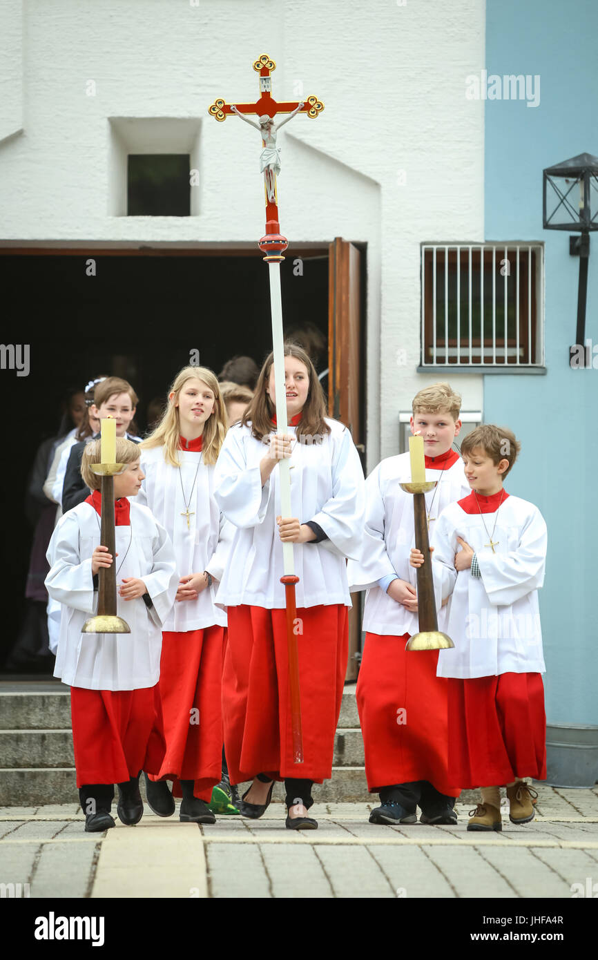 NANDLSTADT, GERMANY - MAY 7, 2017 : A group of altar servers holding ...