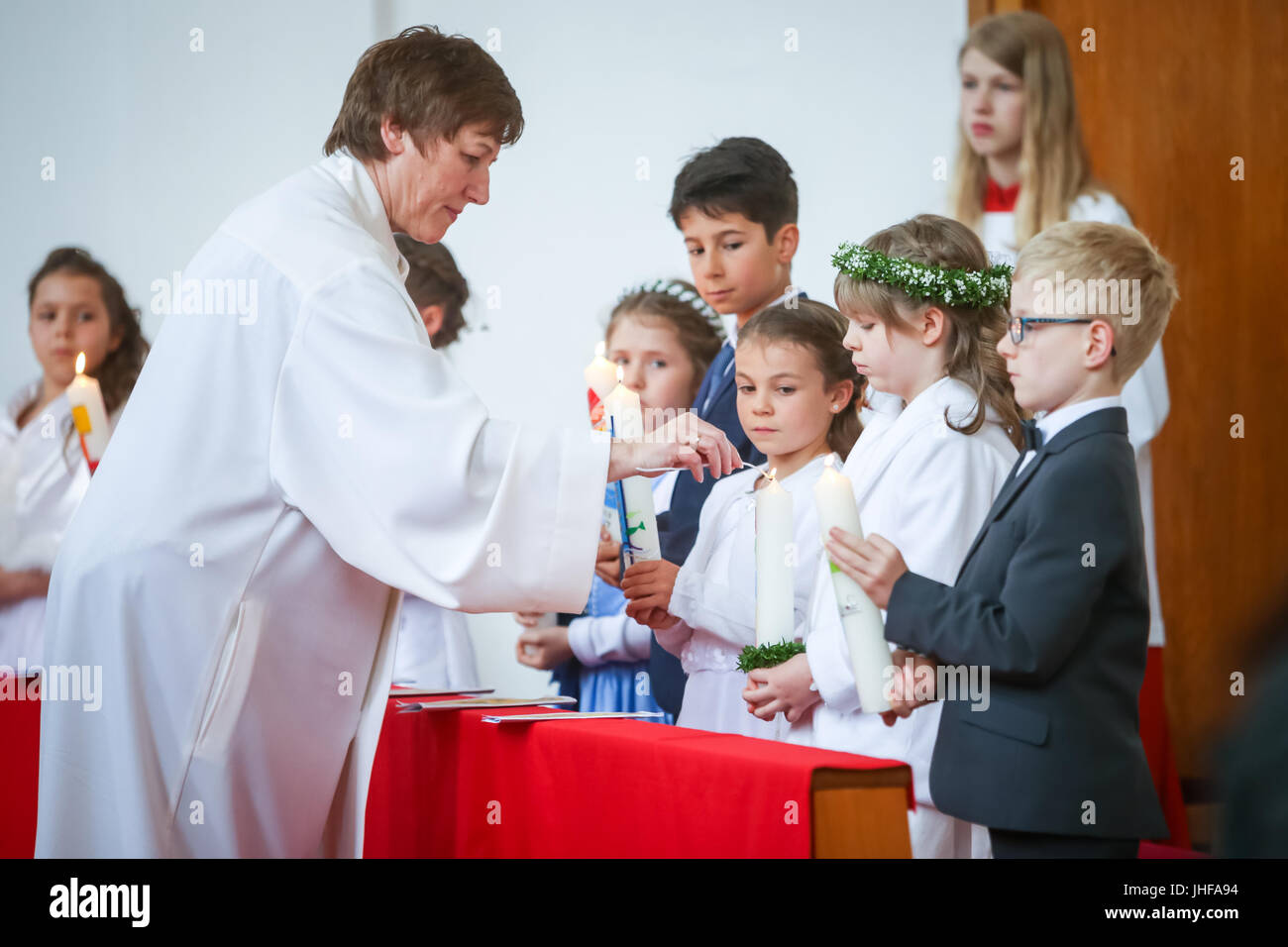 Children at their first communion hi-res stock photography and images ...