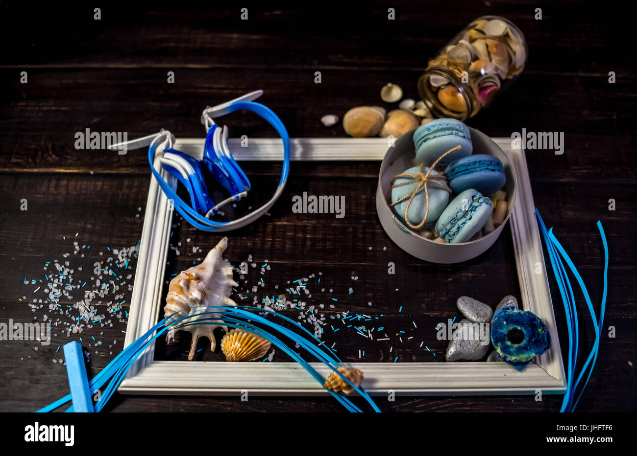 Blue and sea blue macaroons in a marine theme on a dark background ...