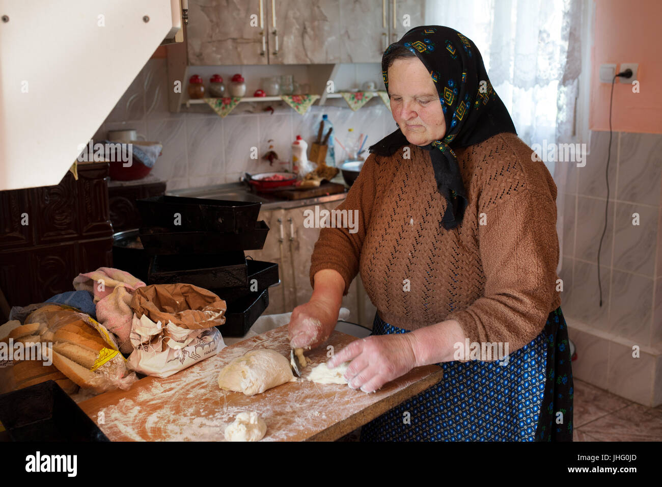 An old woman preparing Easter food, Breb, Maramures, Romania Stock ...