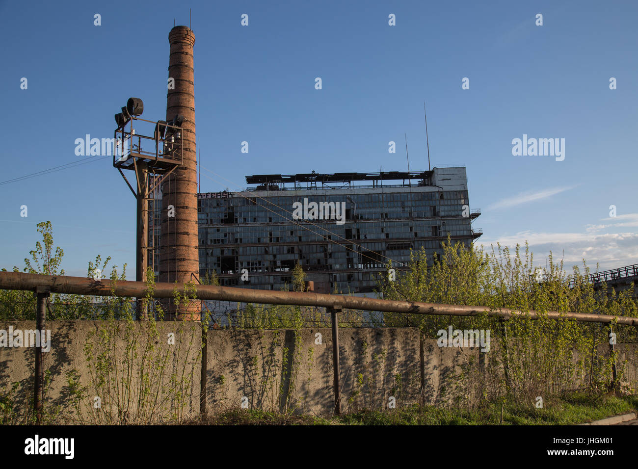 Destroyed industrial site outside pipes Stock Photo - Alamy